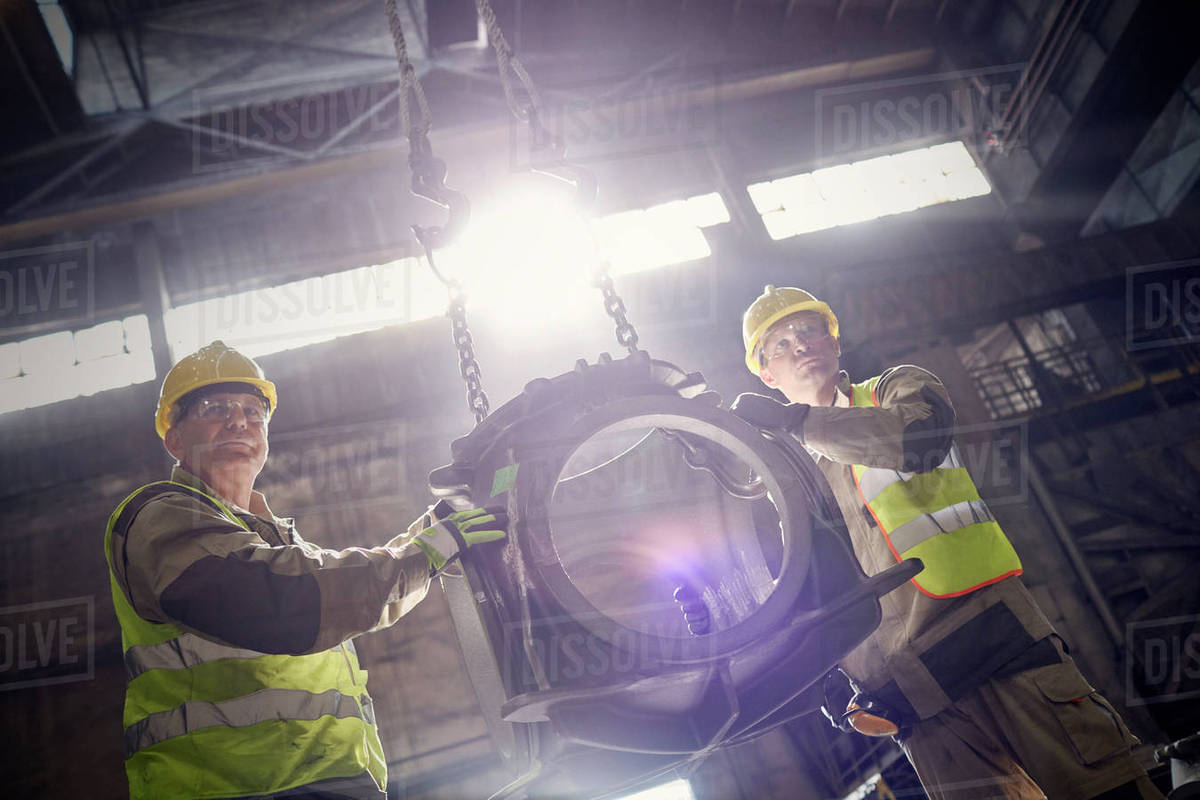 Steelworkers moving steel part in steel mill - Royalty-free Stock Photo ...