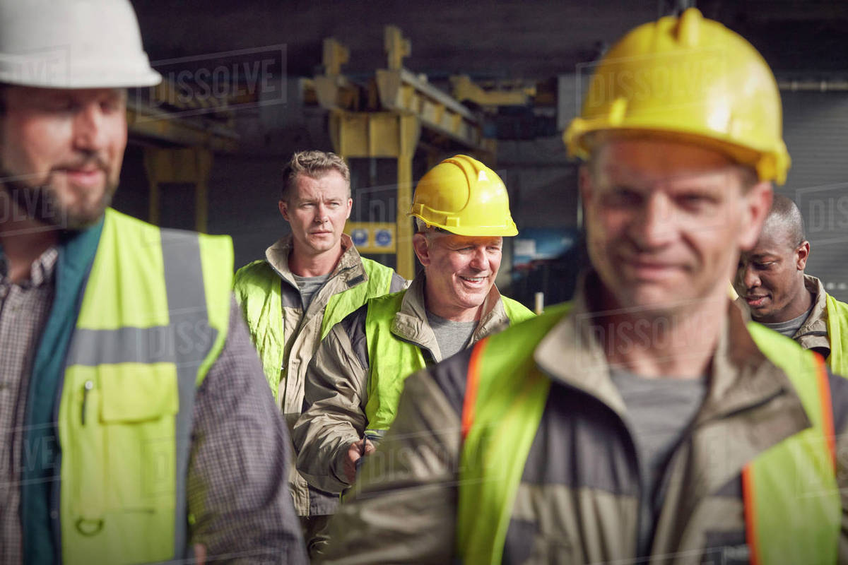Steelworkers walking in steel mill - Royalty-free Stock Photo | Dissolve