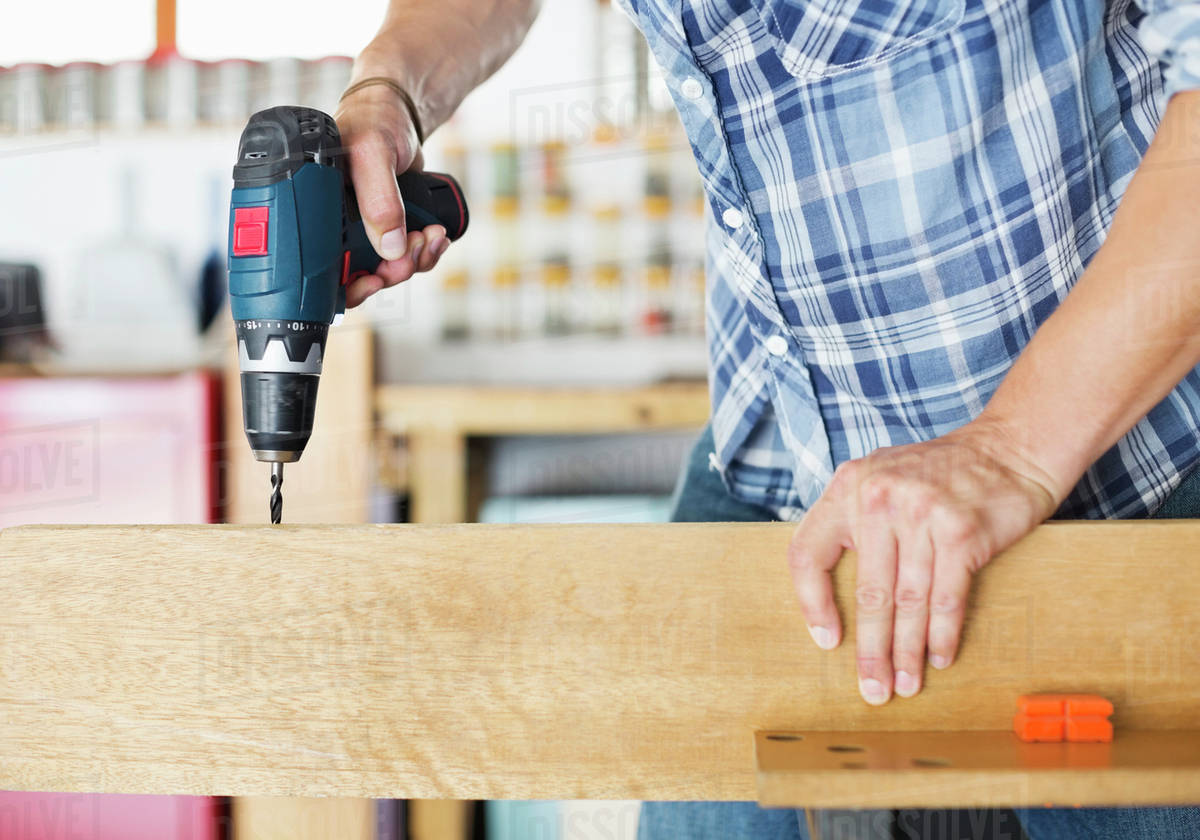 Man working in workshop - Stock Photo - Dissolve