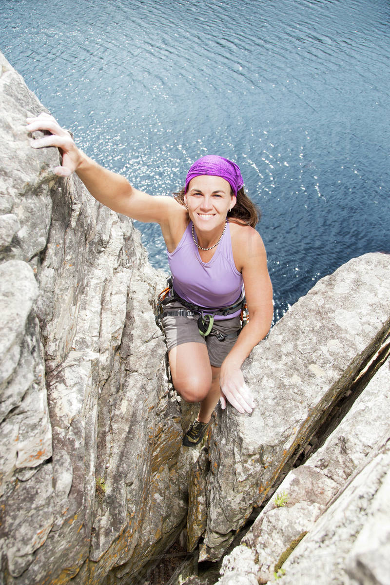 Climber scaling rock face - Royalty-free Stock Photo | Dissolve