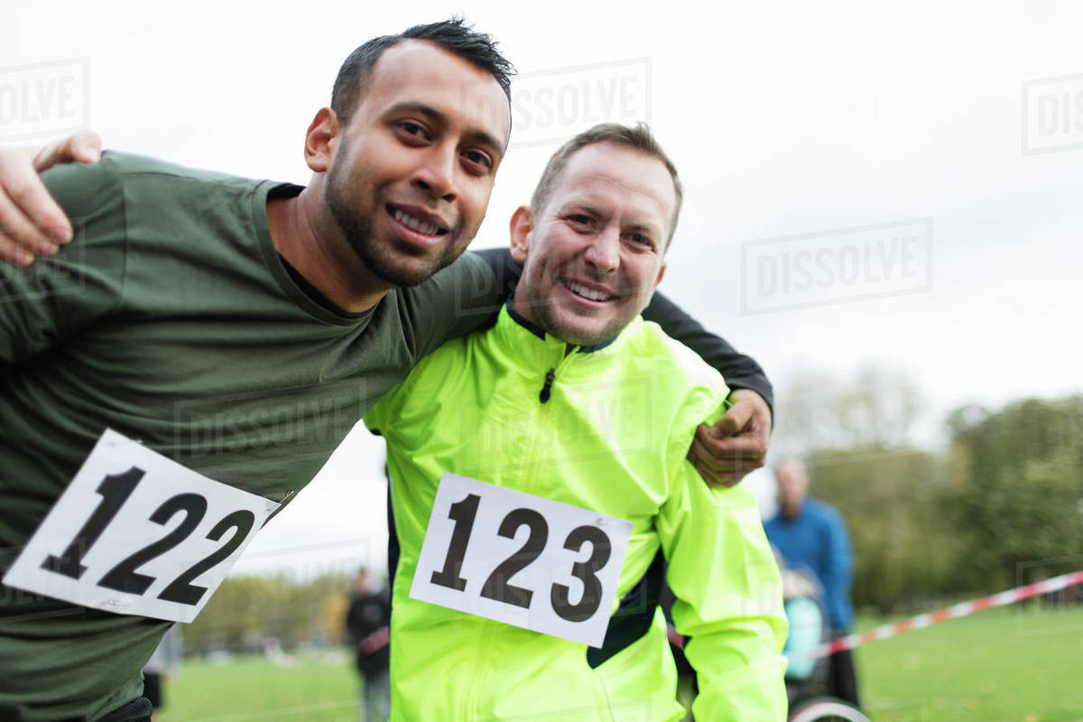 Portrait smiling male marathon runners hugging - Royalty-free Stock ...