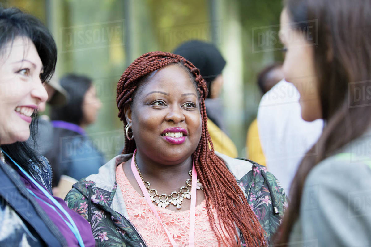 Women talking at conference - Royalty-free Stock Photo | Dissolve
