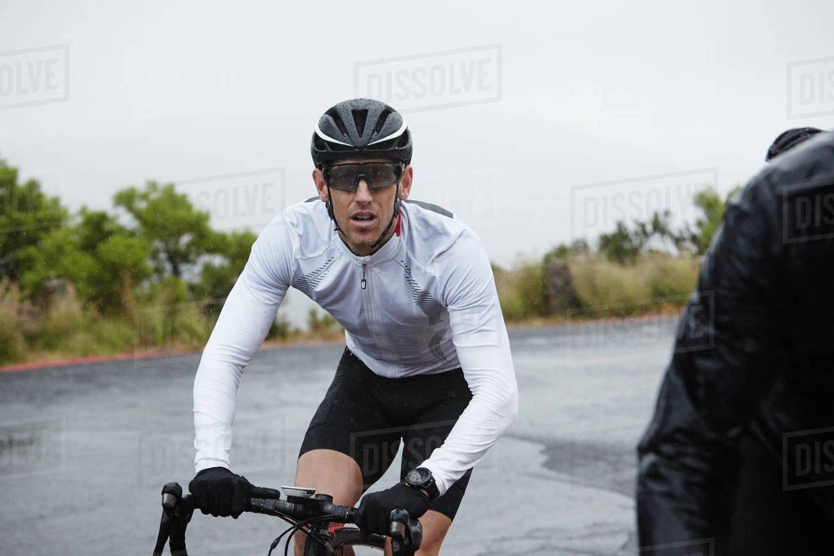 Dedicated male cyclist cycling - Royalty-free Stock Photo | Dissolve