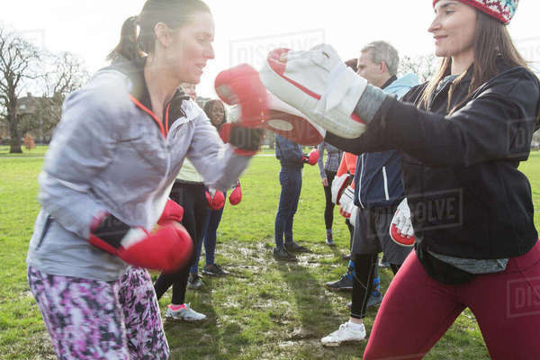 Women boxing in park - Royalty-free Stock Photo | Dissolve