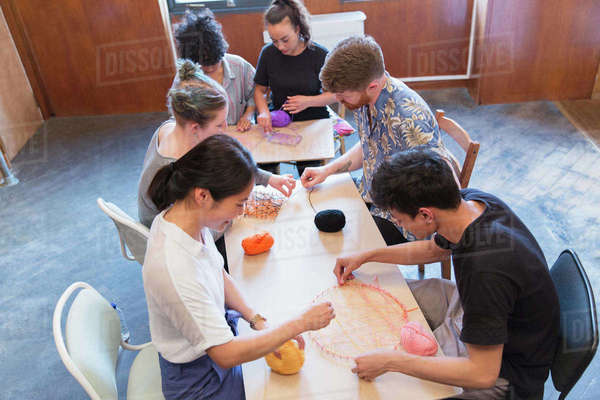 People enjoying string art craft - Royalty-free Stock Photo | Dissolve