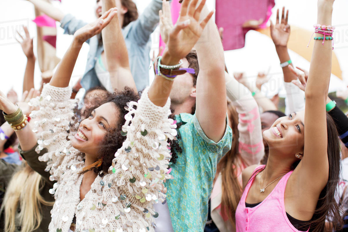 Fans cheering at music festival - Royalty-free Stock Photo | Dissolve
