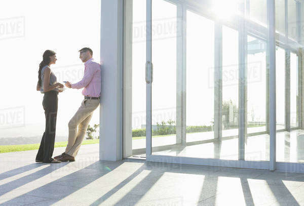 Business people talking outside office - Royalty-free Stock Photo ...
