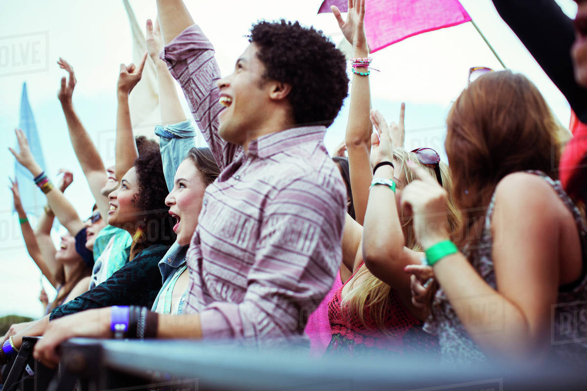 Fans cheering at music festival - Royalty-free Stock Photo | Dissolve