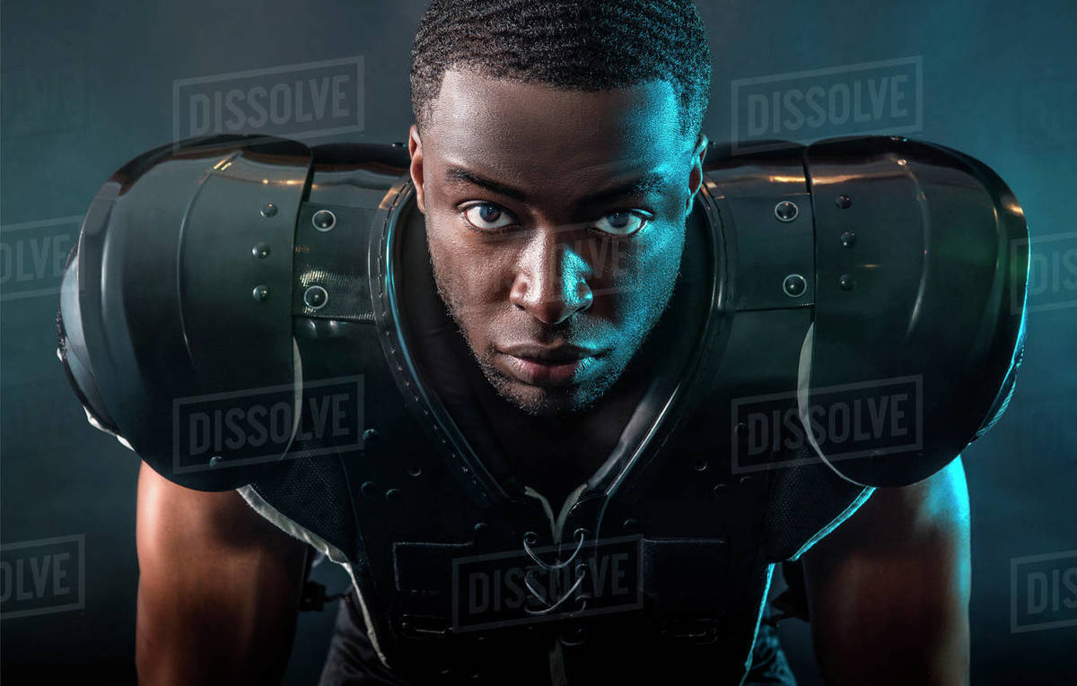 Portrait confident, tough football player wearing pads - Stock Photo ...