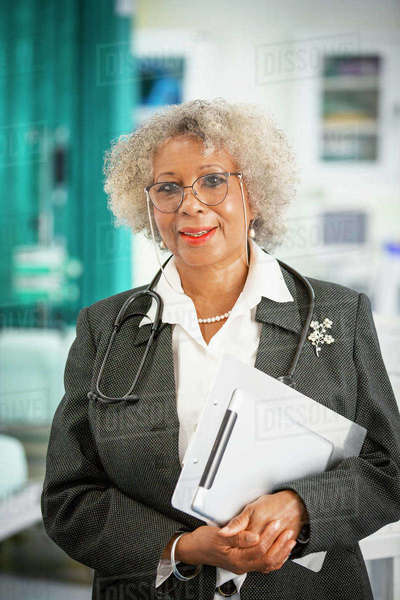 Portrait confident female doctor making rounds in hospital - Royalty ...