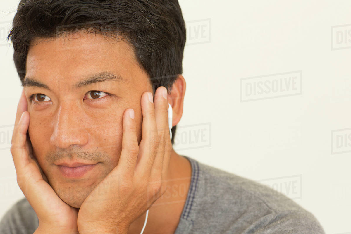 Man resting chin in hands - Royalty-free Stock Photo | Dissolve