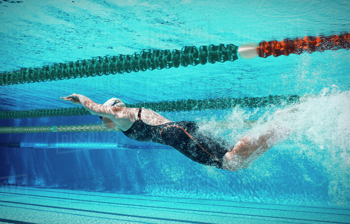 Swimmer racing underwater - Royalty-free Stock Photo | Dissolve