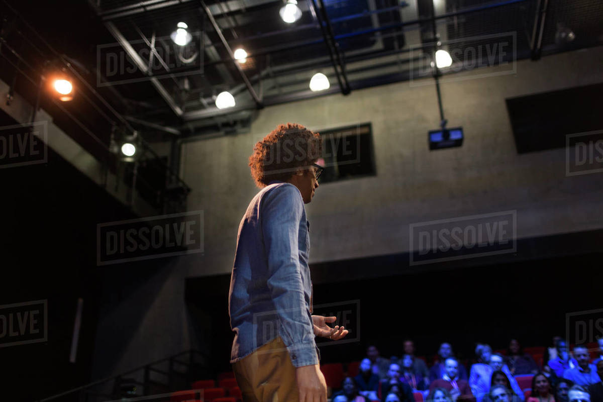 Male speaker on stage talking to audience - Royalty-free Stock Photo ...