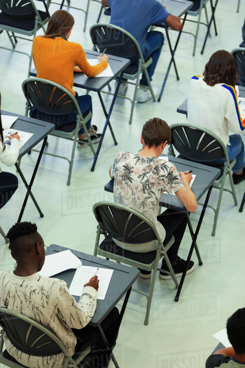 High school students taking exam at desks in classroom - Stock Photo ...