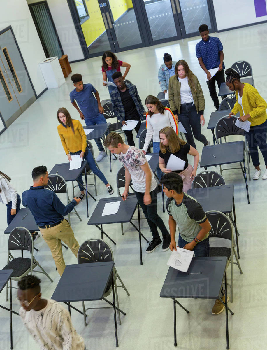 View from above high school students finishing exam at desks - Stock ...