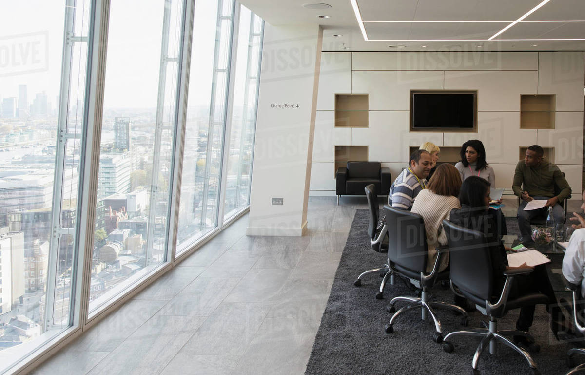 Business people talking in urban conference room meeting - Stock Photo ...