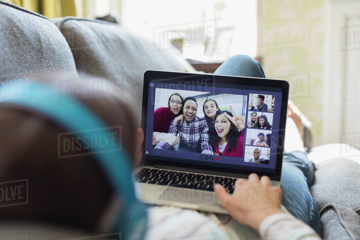Teenage girl video chatting with friends on laptop screen - Stock Photo ...