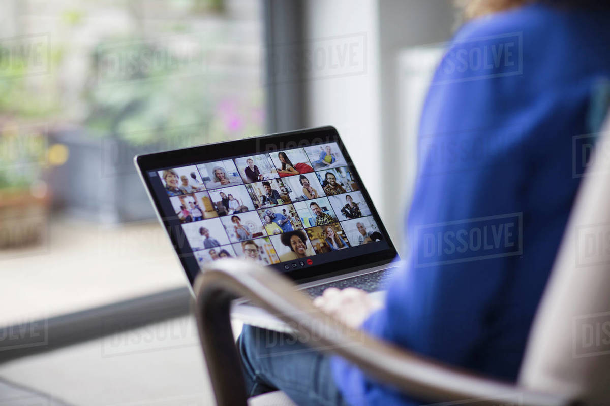Colleagues video conferencing on laptop screen - Stock Photo - Dissolve