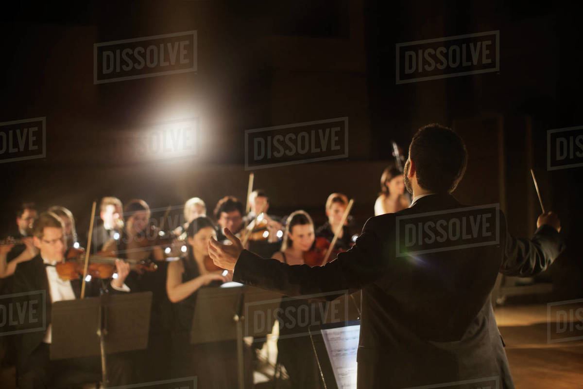 Conductor leading orchestra - Royalty-free Stock Photo | Dissolve