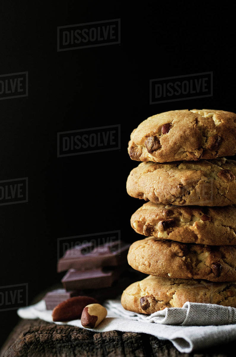 Stack of chocolate chip cookies with Brazil nuts - Royalty-free Stock ...