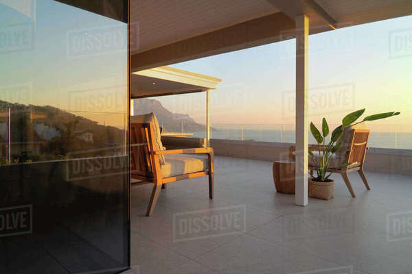 Luxury home showcase patio with tranquil sunset ocean view - Royalty ...