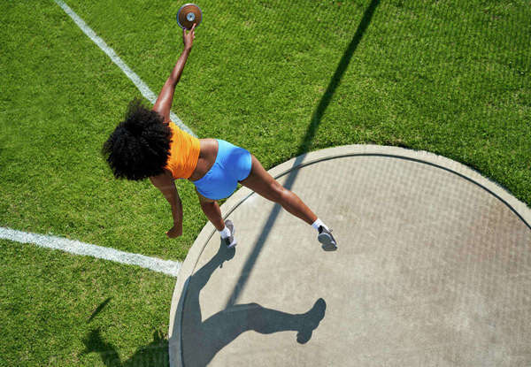 Female track and field athlete throwing discus - Royalty-free Stock ...