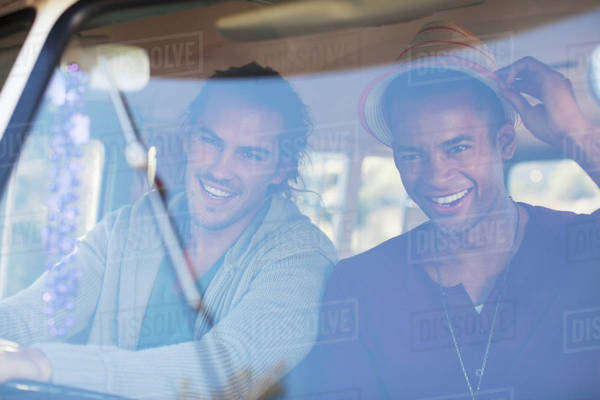 Men smiling in camper van - Royalty-free Stock Photo | Dissolve