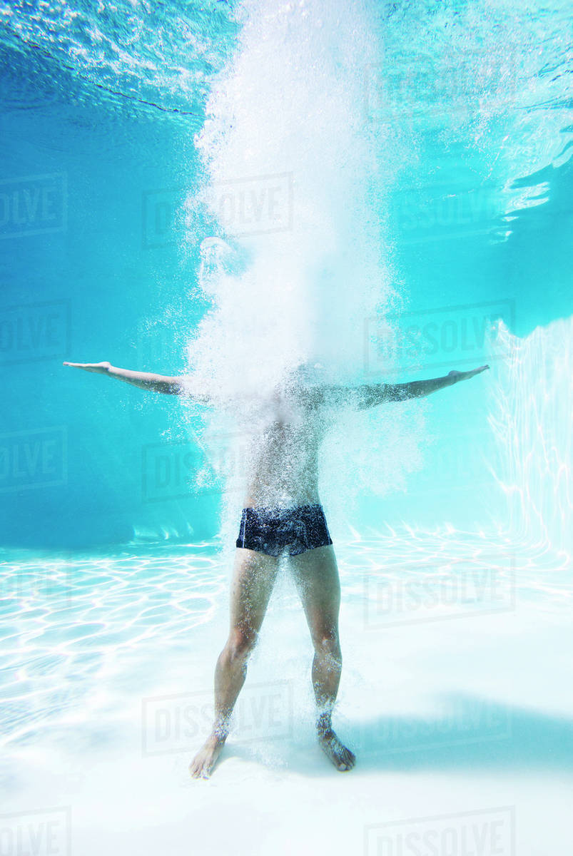 Man standing underwater in swimming pool - Royalty-free Stock Photo ...