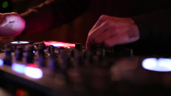 Close-up shot of a DJ playing music - Stock Video Footage - Dissolve