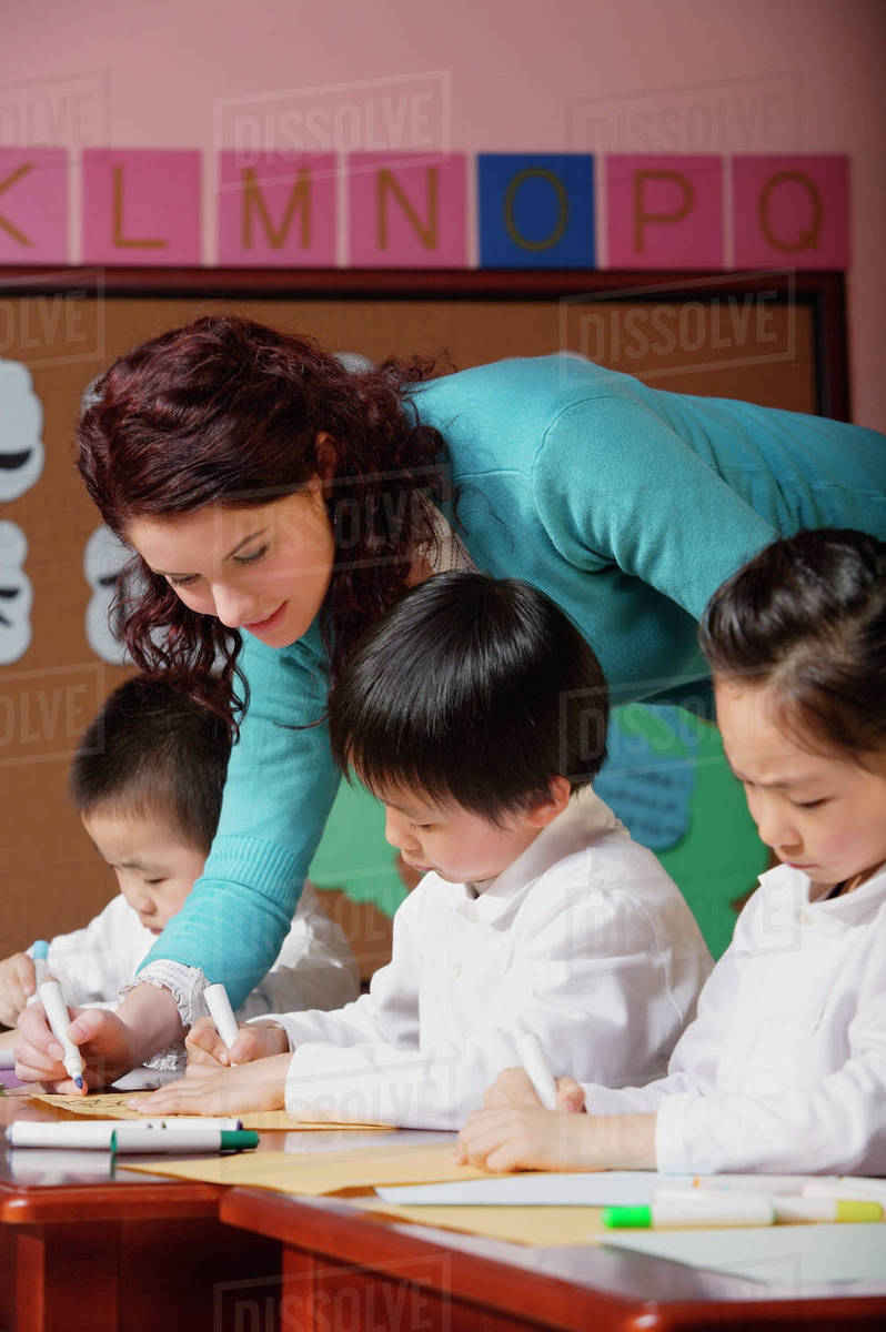 Young school children with their teacher - Royalty-free Stock Photo ...