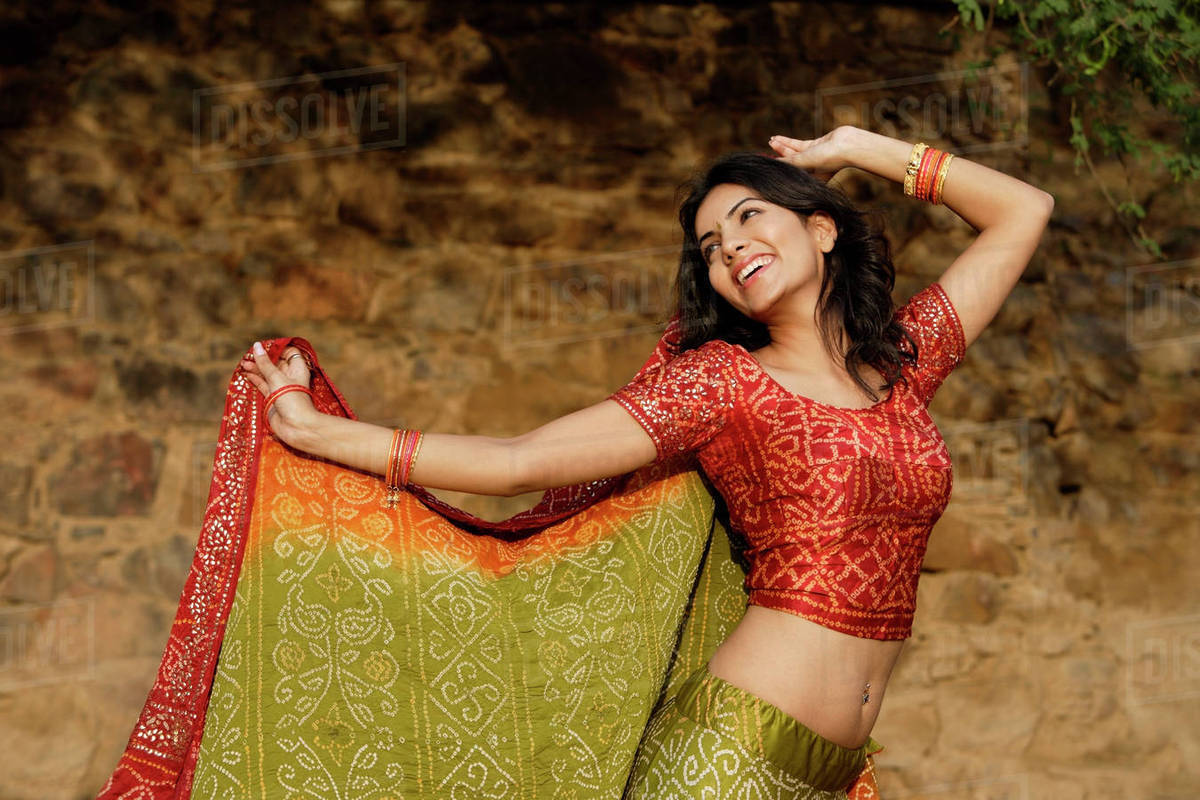 Woman in sari dancing - Royalty-free Stock Photo | Dissolve