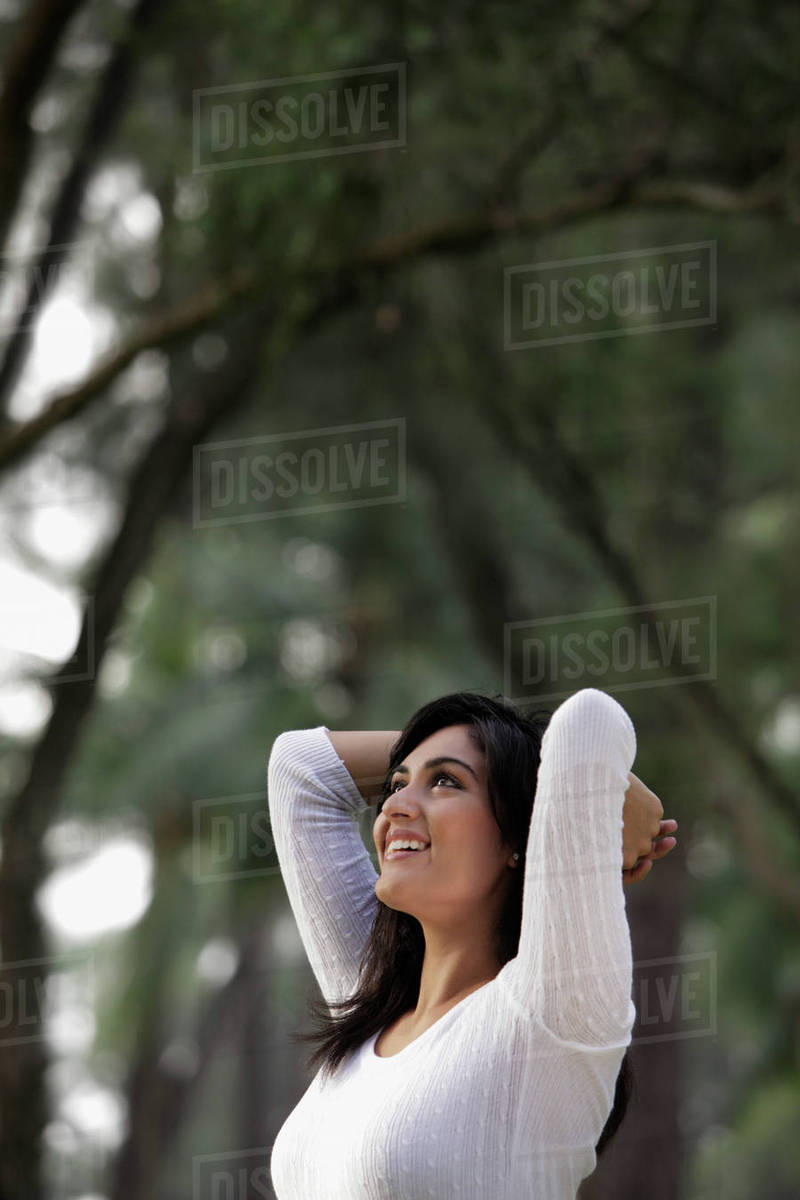 Head shot of young woman in profile looking up - Stock Photo - Dissolve