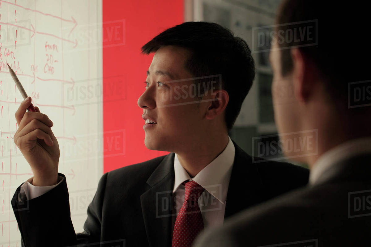 Young man giving a presentation - Stock Photo - Dissolve