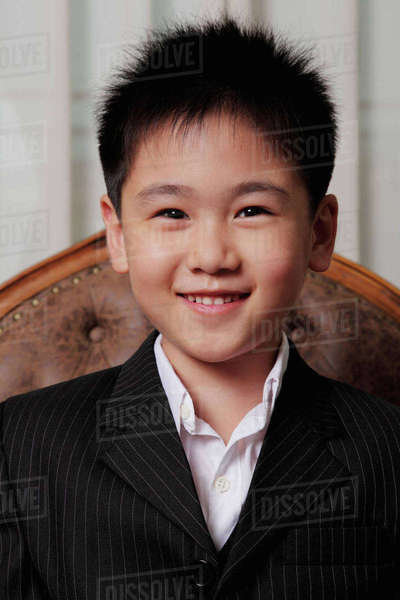 Head shot of young boy smiling - Royalty-free Stock Photo | Dissolve
