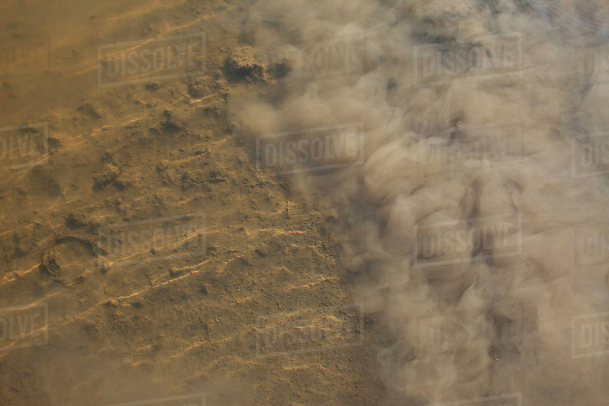 Wind blowing dust - Stock Photo - Dissolve