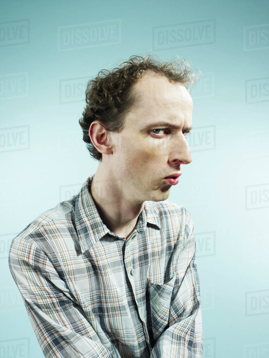 A man looking suspiciously at the camera - Royalty-free Stock Photo ...