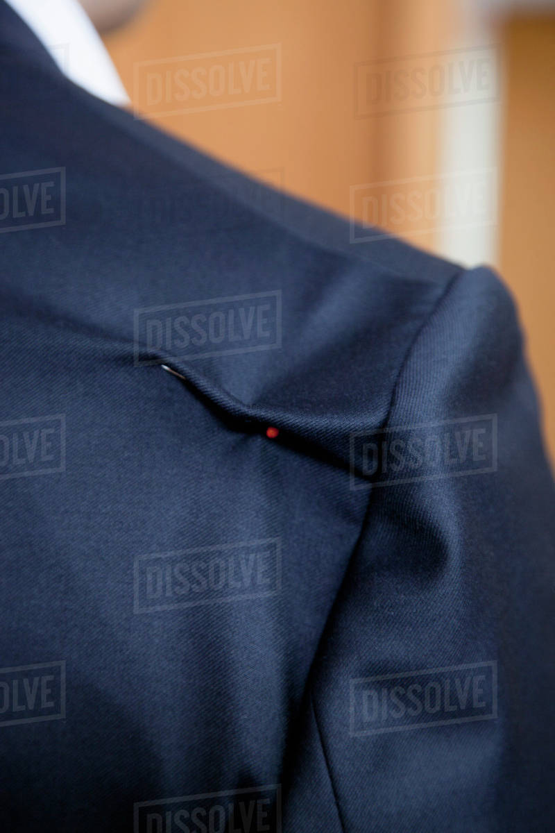Detail of a pin in the shoulder of a suit jacket - Royalty-free Stock ...