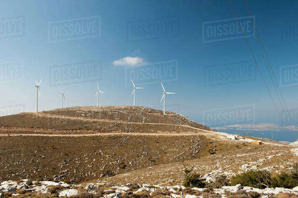 Wind turbines on a hill, Rhodes, Greece - Stock Photo - Dissolve