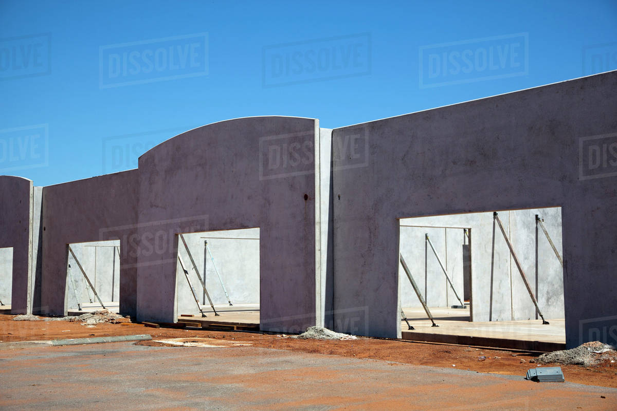Half finished buildings at a construction site - Stock Photo - Dissolve