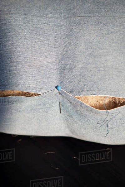 Detail of a pin joining fabric - Stock Photo - Dissolve