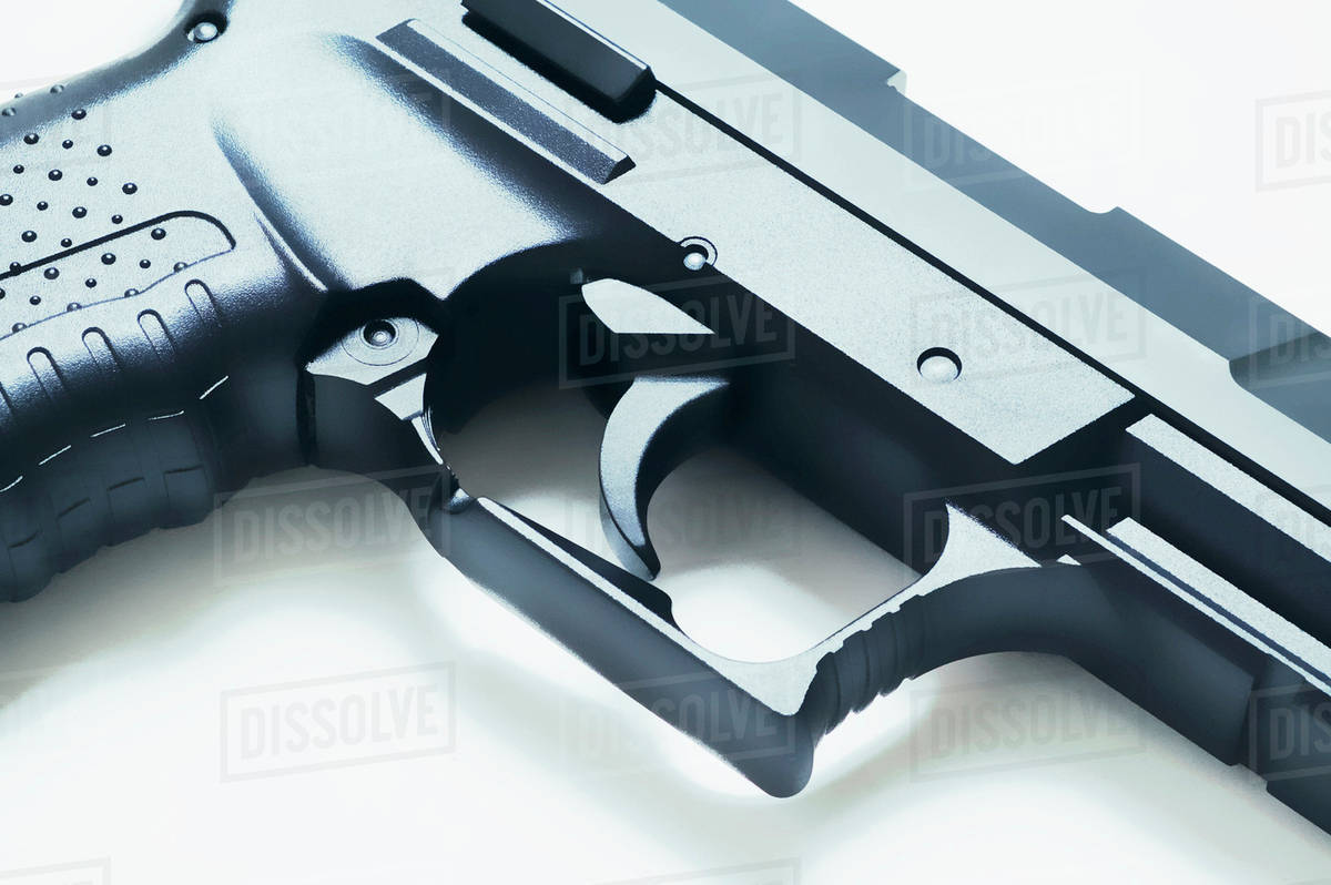 Close-up of trigger on a handgun - Royalty-free Stock Photo | Dissolve