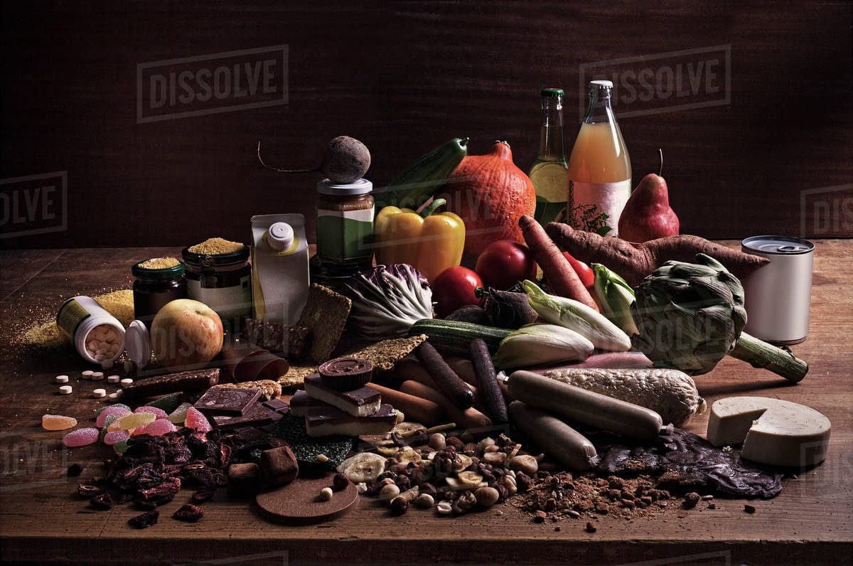 A variety of fresh and processed foods in a heap on a table - Royalty ...