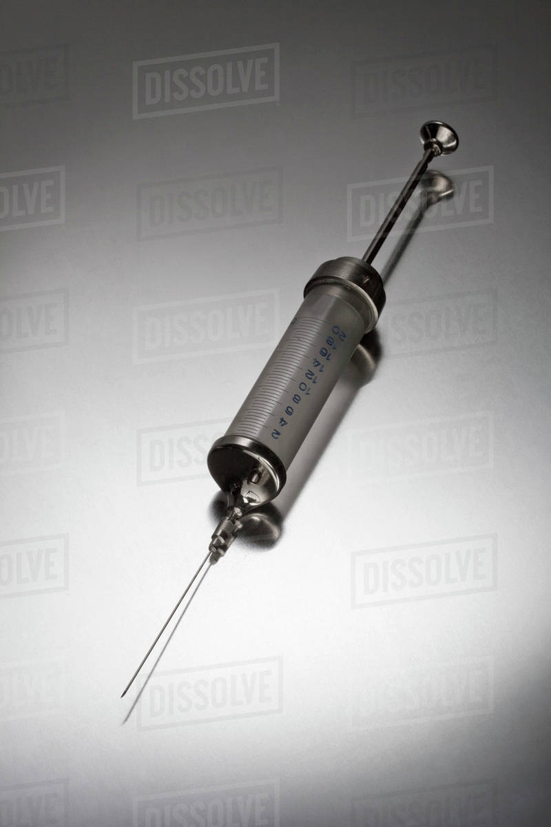 A metal and plastic syringe - Royalty-free Stock Photo | Dissolve