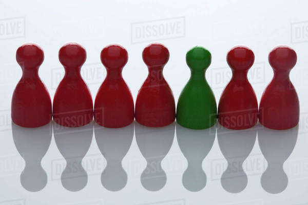Six red game markers and one green game marker in a row - Stock Photo ...