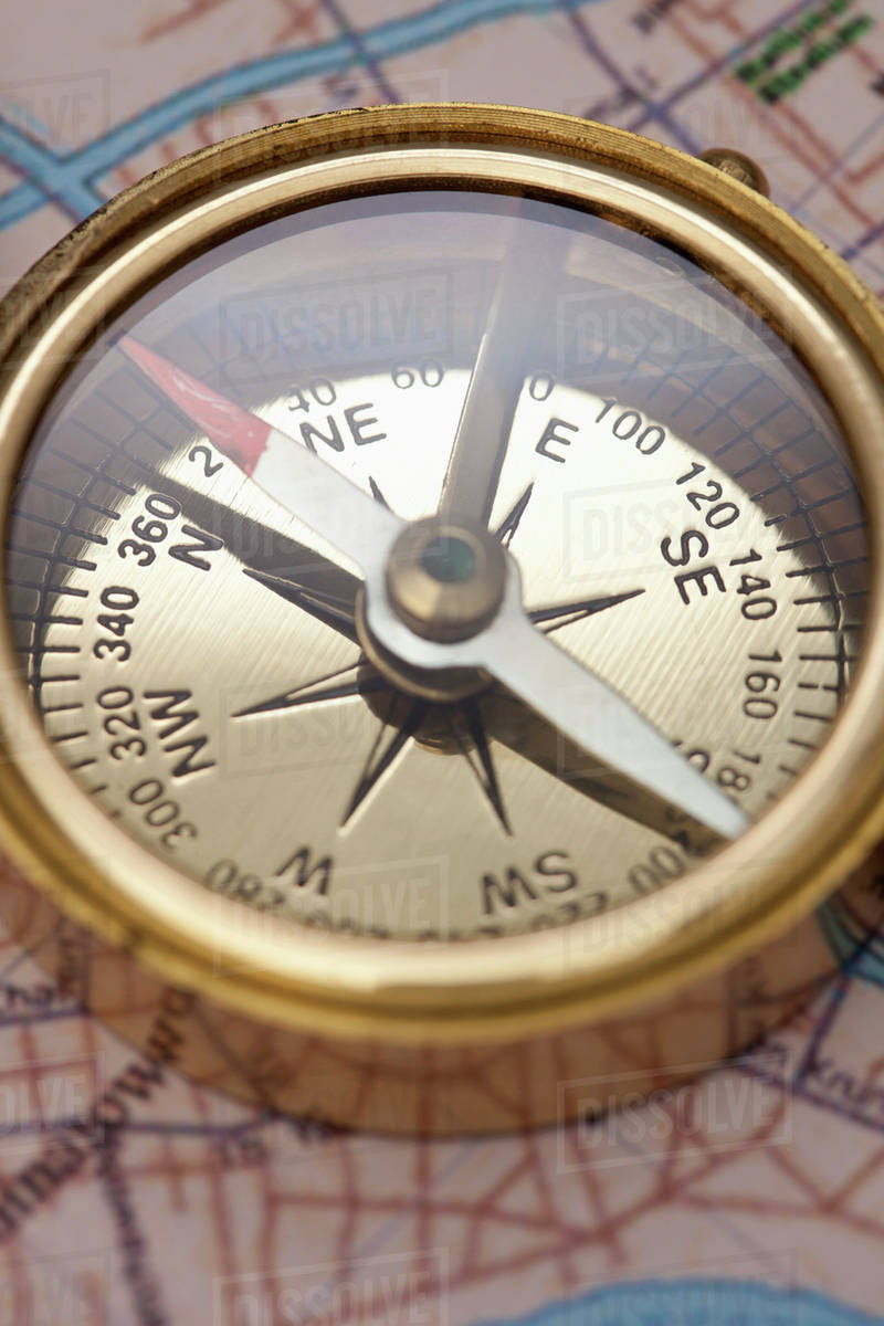 A compass on top of a road map, focus on compass - Royalty-free Stock ...