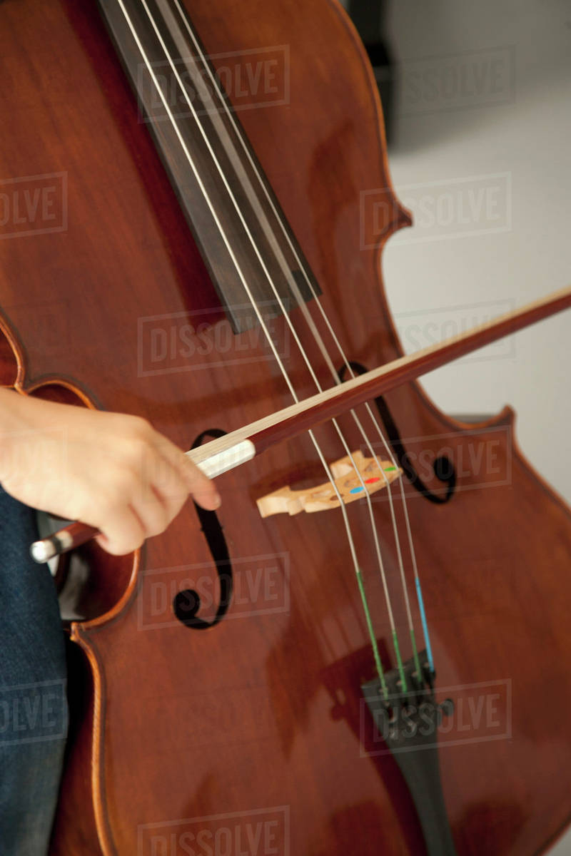 Child playing cello - Stock Photo - Dissolve