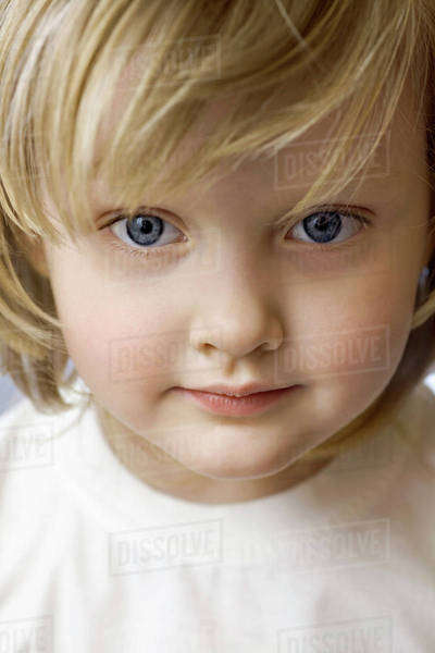 A cute little girl staring blankly - Royalty-free Stock Photo | Dissolve