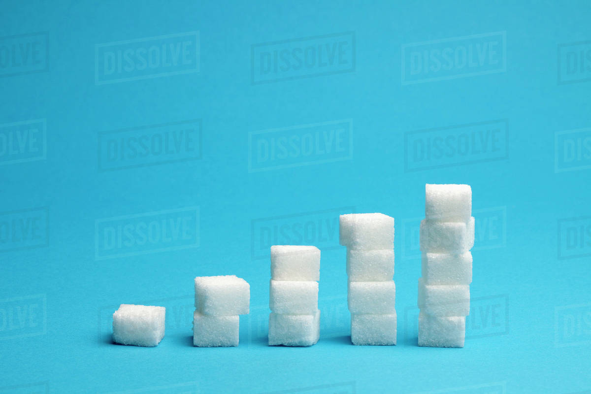 Ascending stacks of sugar cubes - Royalty-free Stock Photo | Dissolve