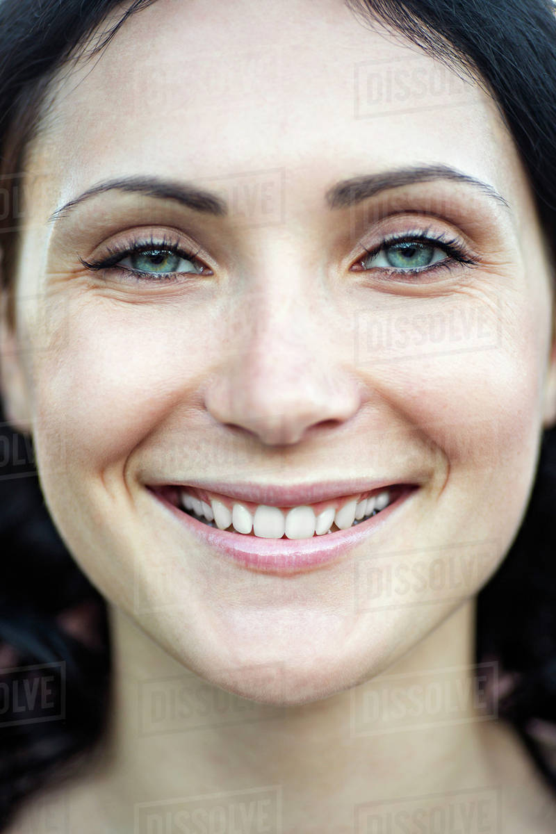 A beautiful young woman grinning into the camera - Royalty-free Stock ...