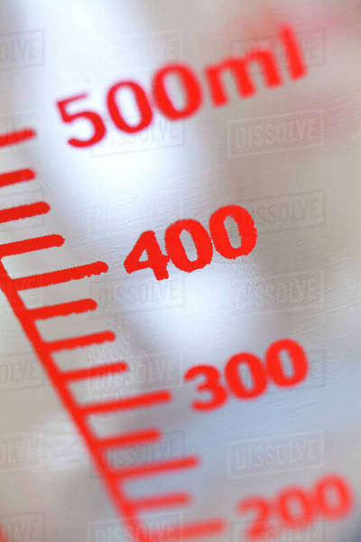 Milliliter measurements on the side of a liquid measuring cup, extreme ...